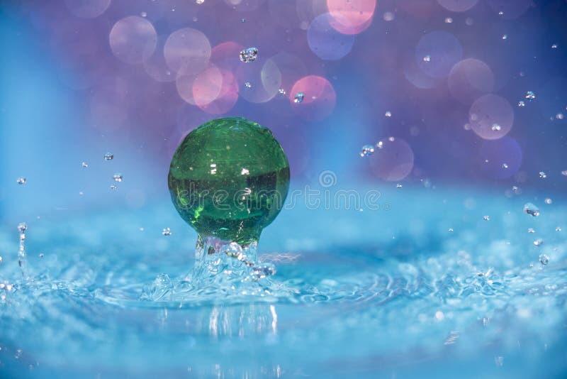 Marbles falling in water. stock photo. Image of water - 4166234