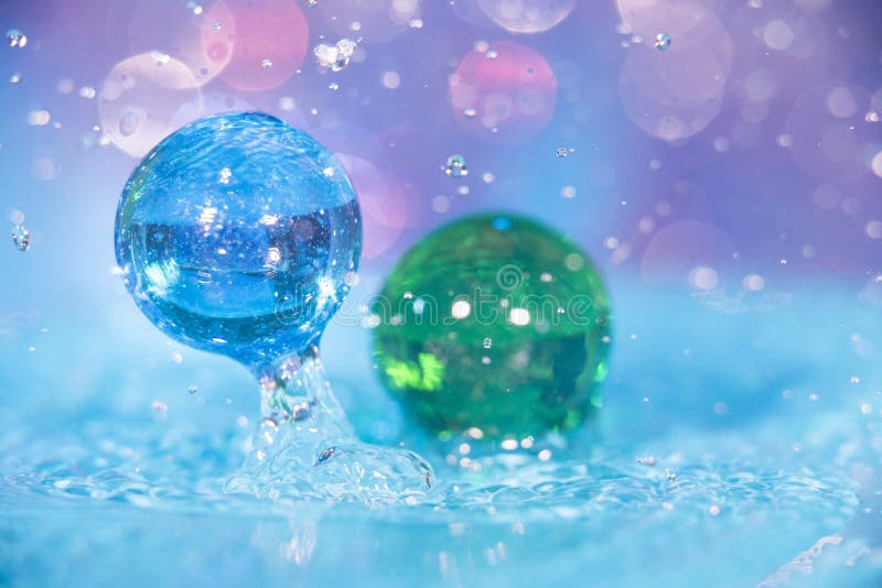 Marbles falling in water. stock photo. Image of water - 4166234