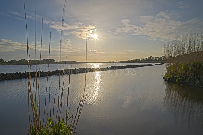 Water in the Morning with Sun Stock Photo - Image of green, clouds ...
