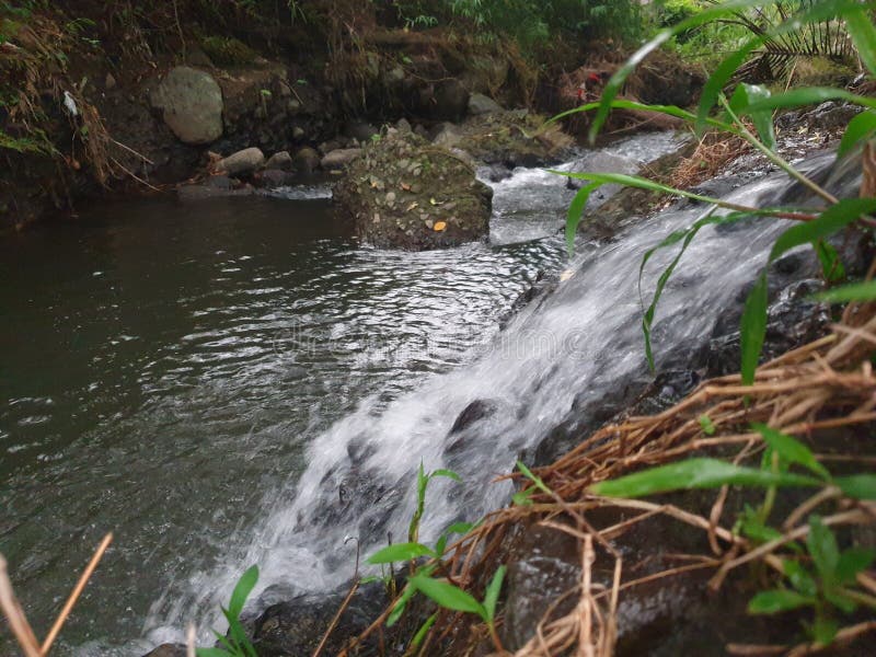 Water from a Mount Under a Waterfall Overflows a Rock Stock Image ...