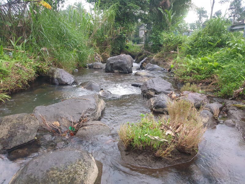 Water from a Mount Under a Waterfall Overflows a Rock Stock Photo ...