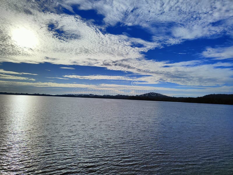 Water and Mountains Seen from Afar Stock Image - Image of morning, wave ...