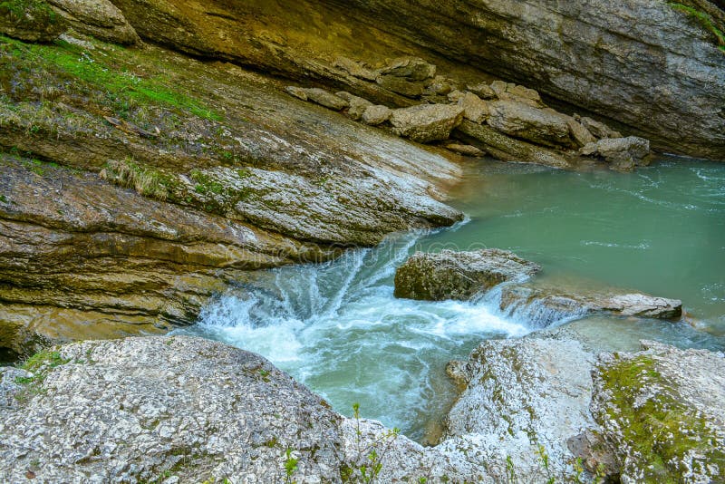 Water Over the Rock Flows into a Mountain Stream Stock Photo - Image of ...