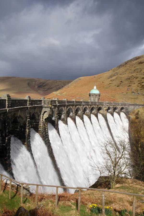 Water overflowing a dam. stock photo. Image of powys, mountains - 4714614