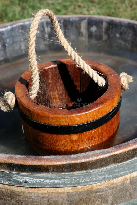 Water Pail in Barrel stock image. Image of beverage, brown - 949991