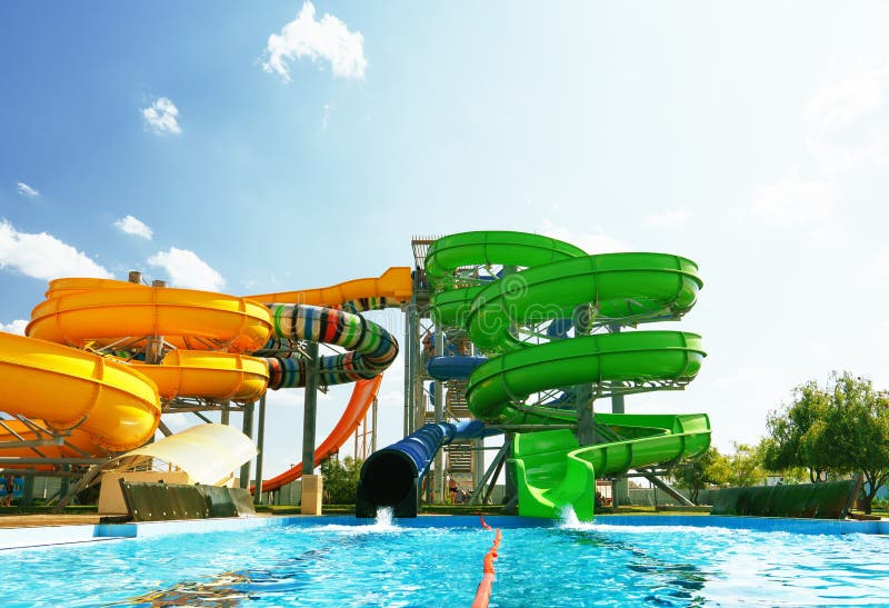 Water Park, Bright Multi-colored Slides with a Pool Stock Image - Image ...