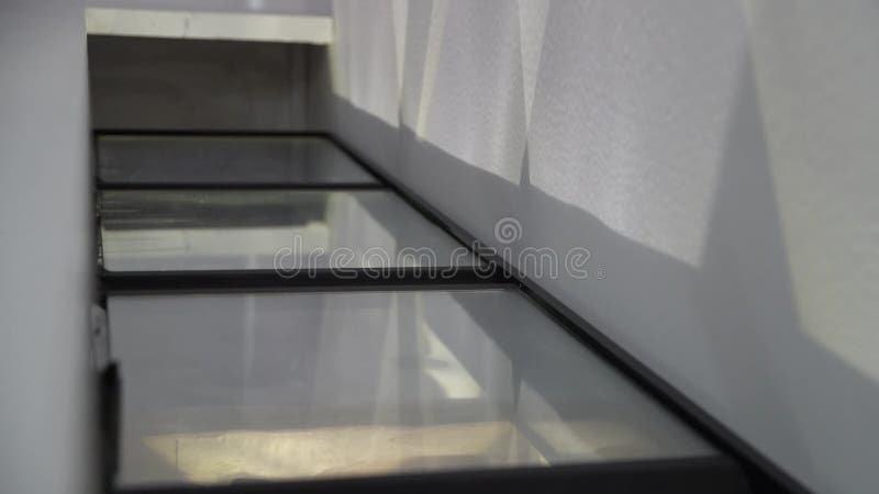 Water Pattern Projected and Reflected on a White Wall by an ...