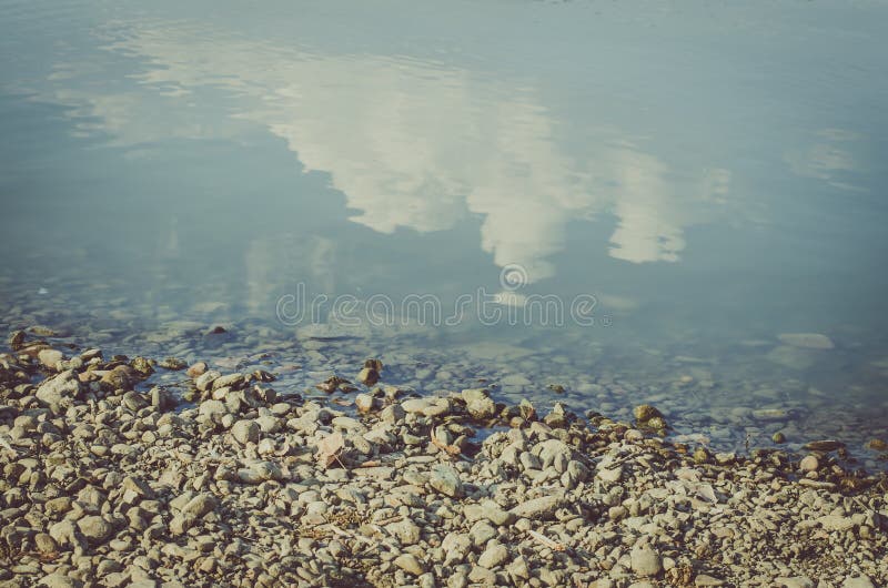 Water and pebbles stock image. Image of rocks, neutral - 117666401