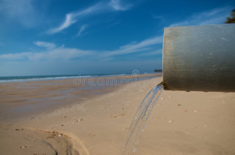 Water pipe at a beach stock image. Image of brown, running - 12645797