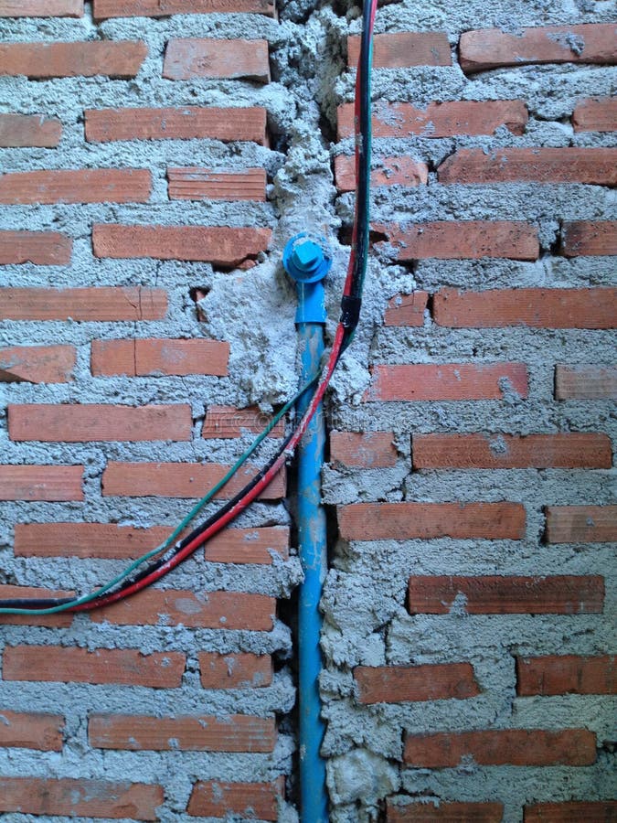 Water Pipe in Brick Wall stock image. Image of plumber - 69289663