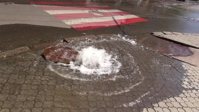 Water Pipe Burst, Water Water Flows Out of the Manhole Onto the Asphalt ...