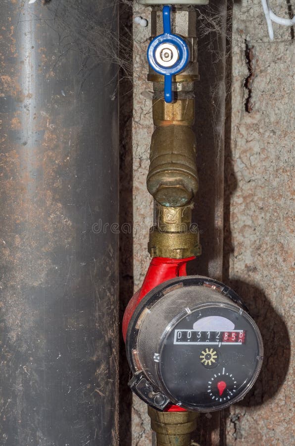 Water Pipe with a Tap and Cold Water Meter in an Old Room with a Cobweb ...