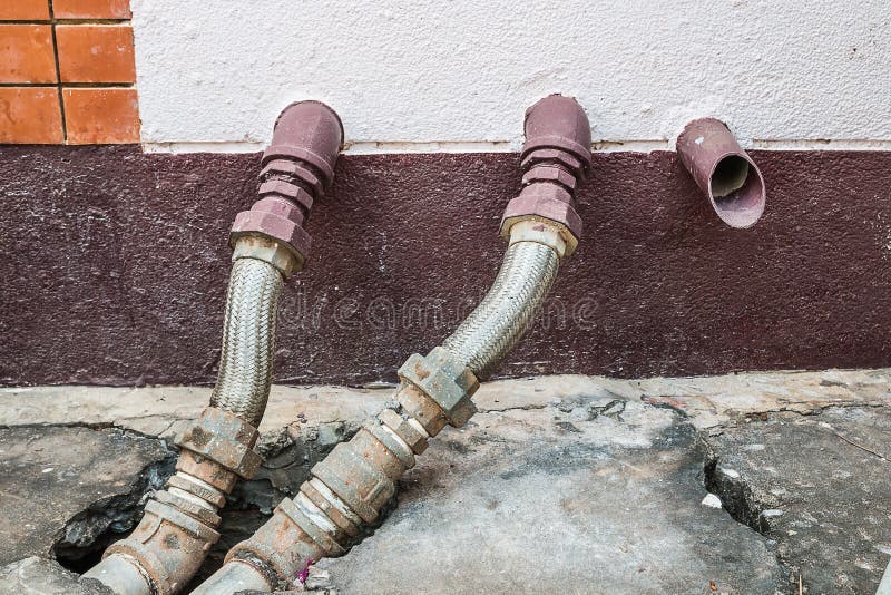 Water pipe from wall stock photo. Image of sewer, iron - 93522066