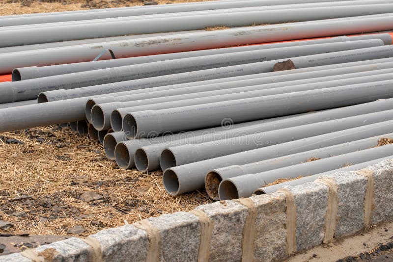 Water Pipes Lying on the Ground Stock Photo - Image of stake, tube ...
