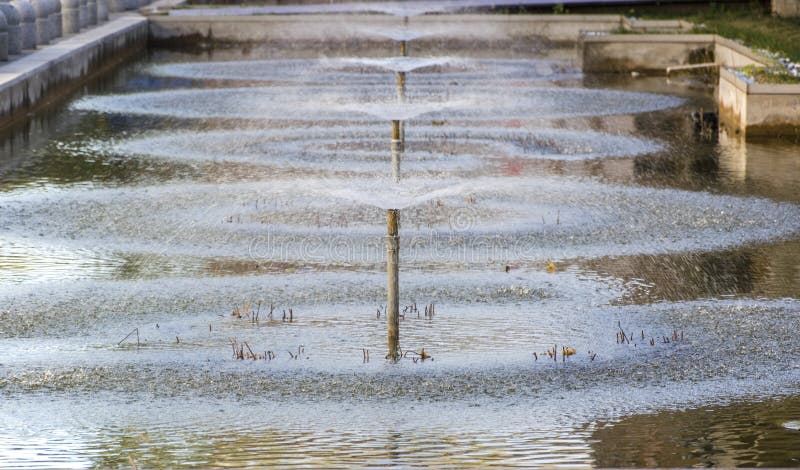 Fountain in the pond stock photo. Image of concrete - 130375900