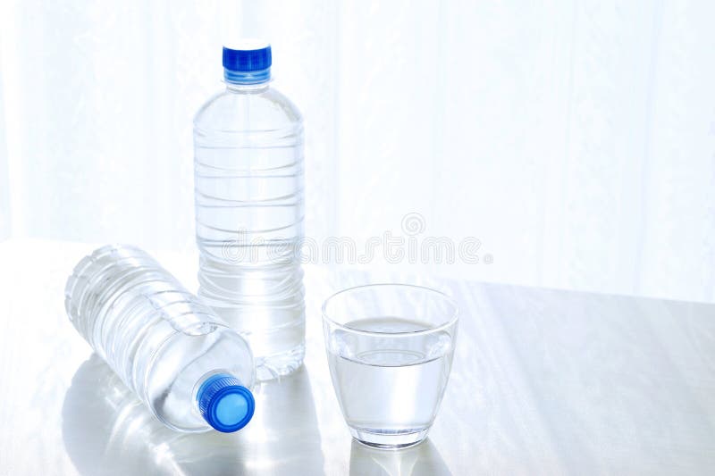 Water of Plastic Bottle and Glass on Table Stock Image - Image of clear ...