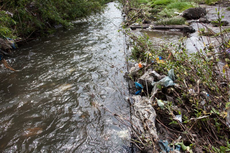 Water Pollution. Garbage Near the Urban Stream Stock Photo - Image of ...