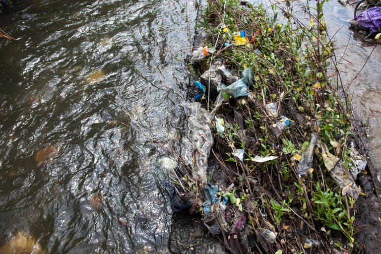 Water Pollution. Garbage in the Urban Stream Stock Photo - Image of ...