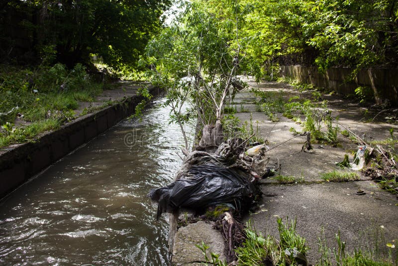 Water Pollution. Garbage on the Urban Stream Banks Stock Image - Image ...