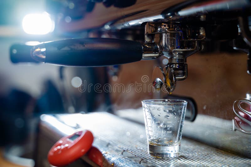 Water is Poured from the Coffee Machine into the Beaker Stock Photo ...