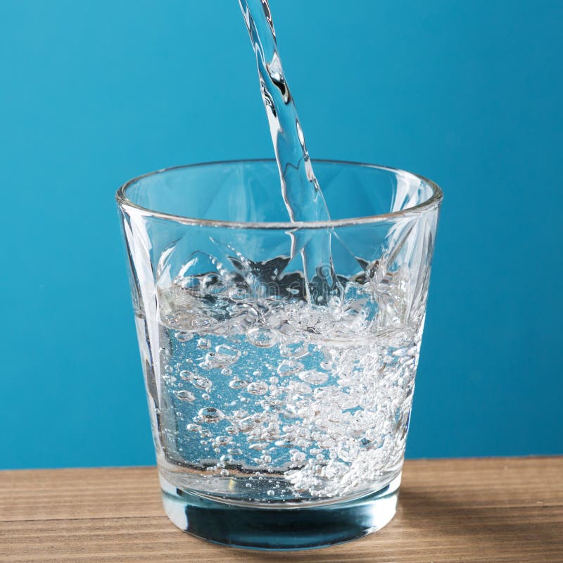 Glass Cup With Water On A Blue Background Close-up Stock Photo - Image ...