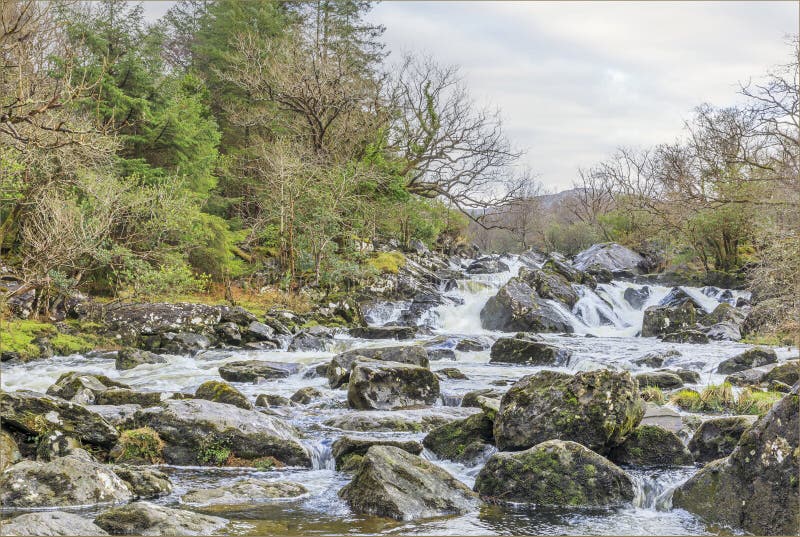 Water Pouring Fast Over Rocks Down a Hillside Stock Photo - Image of ...