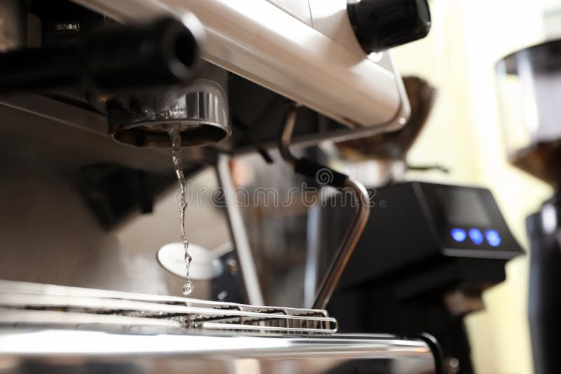 Water Pouring from Modern Coffee Machine, Closeup Stock Image - Image ...