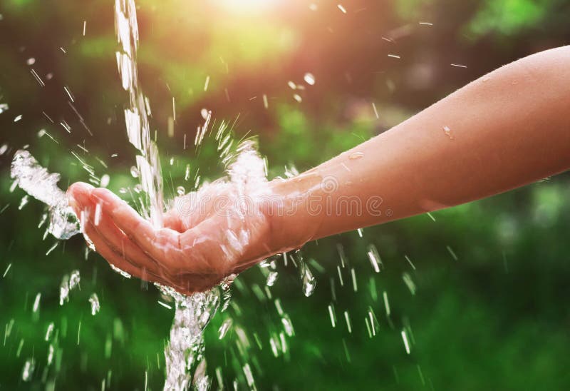 Water Pouring Splash in Hand and Nature Background Stock Photo - Image ...