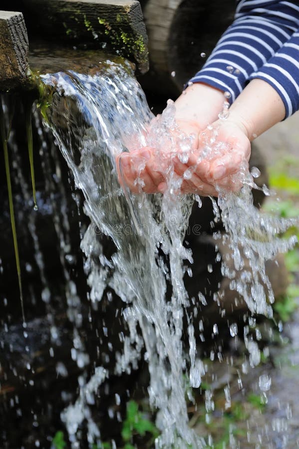 Water Pouring in Woman Hand Stock Image - Image of handful, green: 98318571