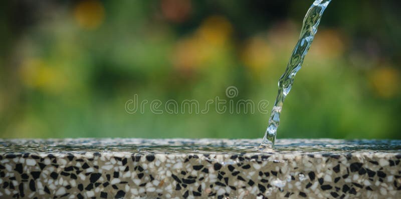 Water Pours on the Table in the Garden Stock Image - Image of glass ...