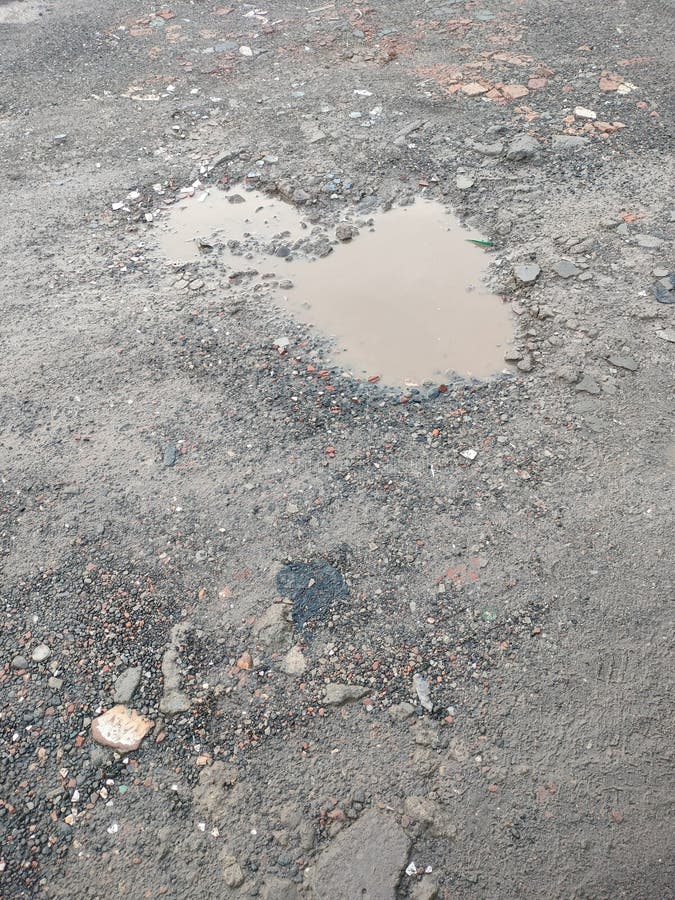 Water Puddle in the Brown Ground Leftover Rain Stock Photo - Image of ...