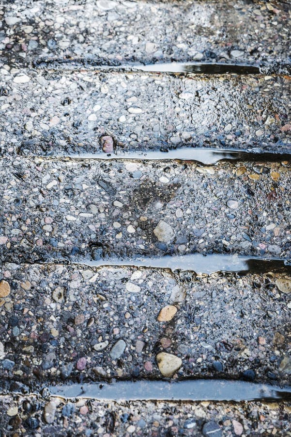 Puddles on the Cement Floor There are Bubbles and Reflections of the ...