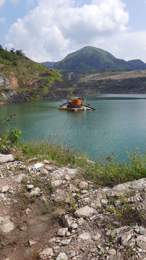 Water Pump Machine in the Middle of Coal Mine Lake Stock Photo - Image ...