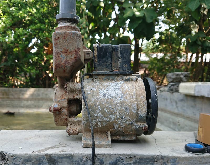 A Water Pump Machine that is Rusty and No Longer Working Stock Image ...