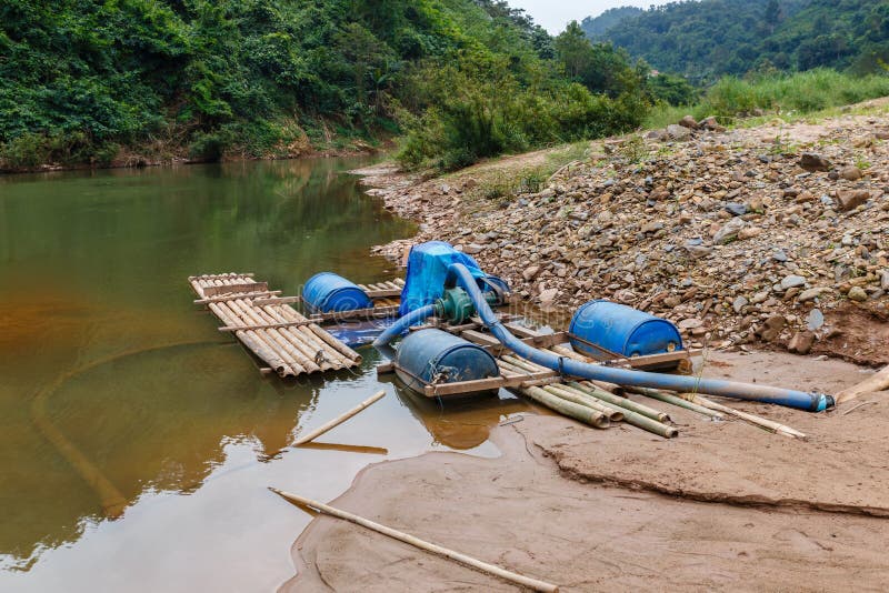 Water Pump on a Bamboo Raft Stock Image - Image of barrel, equipment ...