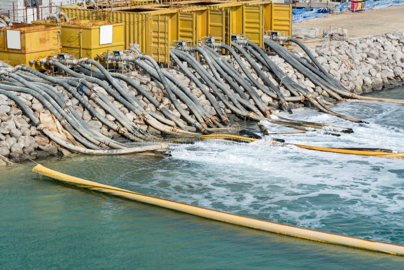 Water Pumping from Construction Site, Flowing into the Sea Stock Photo ...