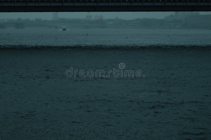 Water in Rainy Day with Part of a Bridge. Rain Falling on the River ...