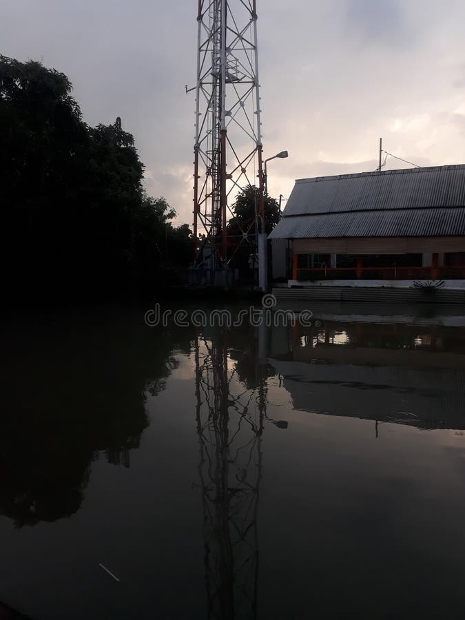 Water Reflection of the Tower and House Stock Photo - Image of ...
