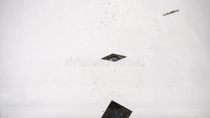 Water-resistant Computer Micro Chips Falling into Water, Slow Motion on ...