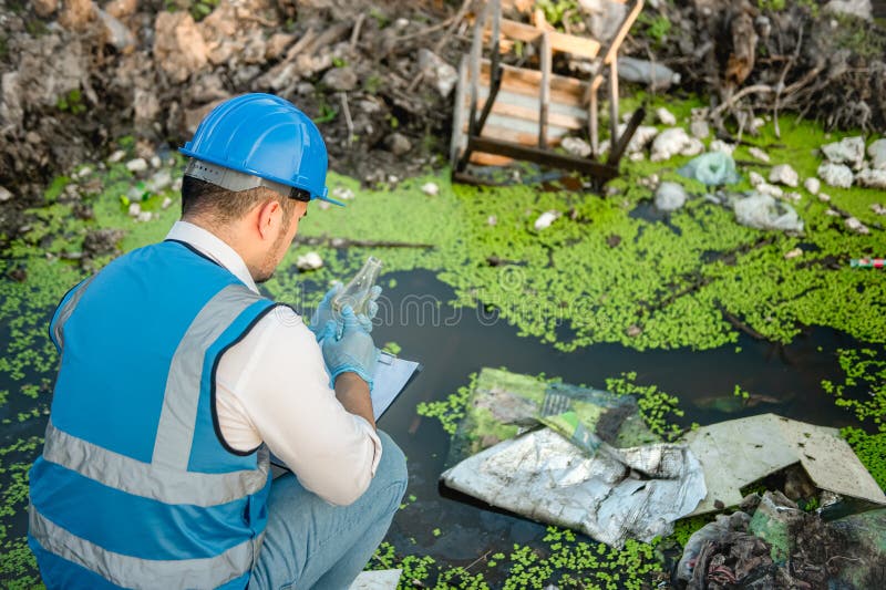 Water Resource Experts Check the Water Quality in a Community Canal ...