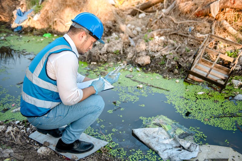 Water Resource Experts Check the Water Quality in a Community Canal ...