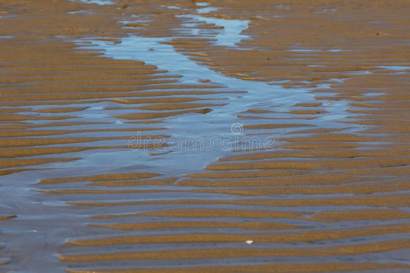 Water on Rippled Sand on a Beach Stock Image - Image of light, liquid ...