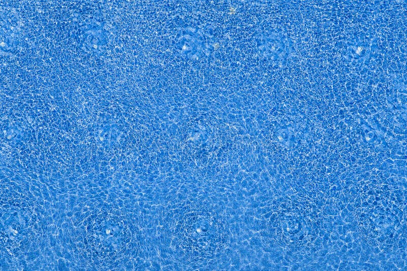 Water Ripples on Blue Tiled Swimming Pool Background. Top View Stock ...