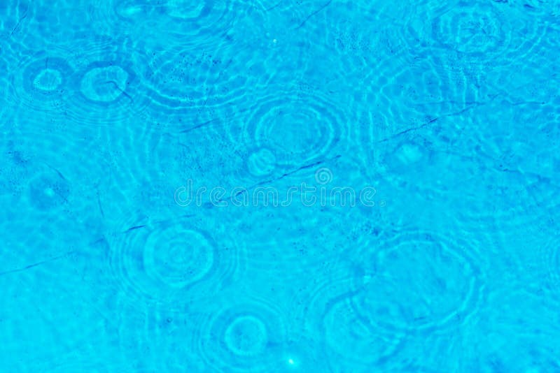 Ripples from Rain Puddles . Stock Photo - Image of pond, ripple: 53263378
