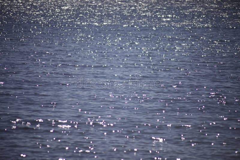 Water Ripples with Reflections of the Sun Stock Photo - Image of motion ...