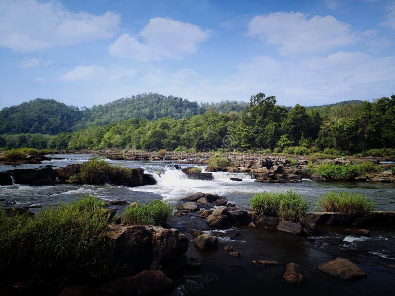 The Water and Rocks are Moving by in the Stream As Seen from Behind ...