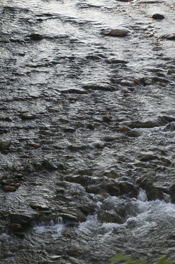 Water running over pebbles stock photo. Image of river - 31073176