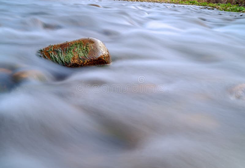 Water Rushing Down a Mossy Rock in a River Stock Photo - Image of ...
