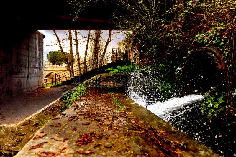 Water Rushing Out of the Pipe Under the Bridge Stock Image - Image of ...