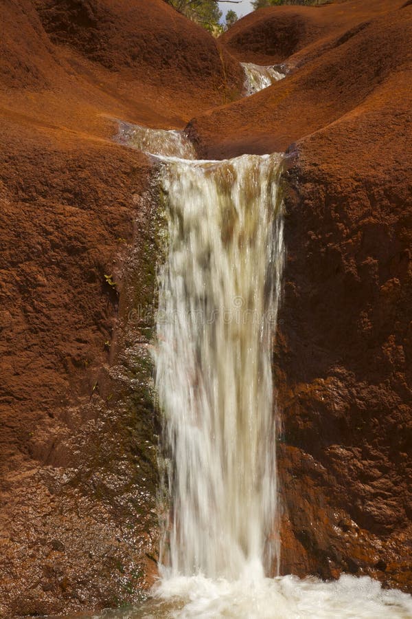Water Rushing Over Red Rocks Stock Image - Image of landscape, kauai ...